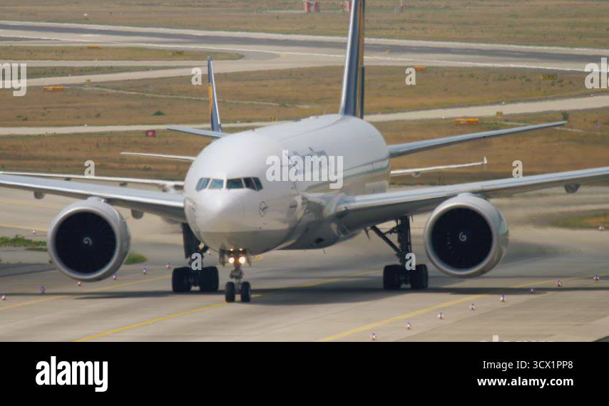 Boeing 777 taxiing after landing Stock Video Footage - Alamy