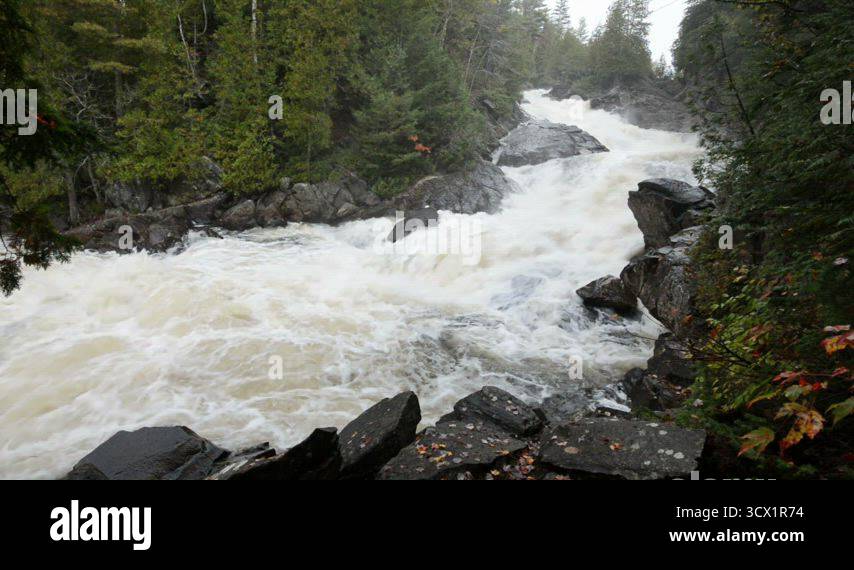 A small cascade on a highland river flows through stony riverbed Stock ...
