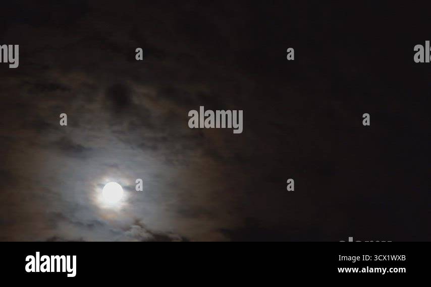 Mysterious night sky with full dramatic moon clouds in the moon light ...