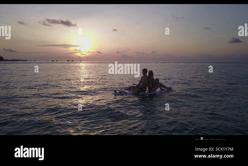 Happy lady and man on honeymoon vacation have fun on beach on white ...