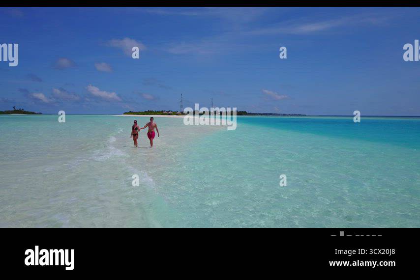 Fun people on romantic honeymoon have fun on beach on white sand ...