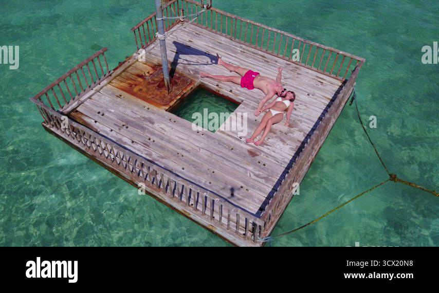 Young lady and man on honeymoon vacation live the dream on beach on ...