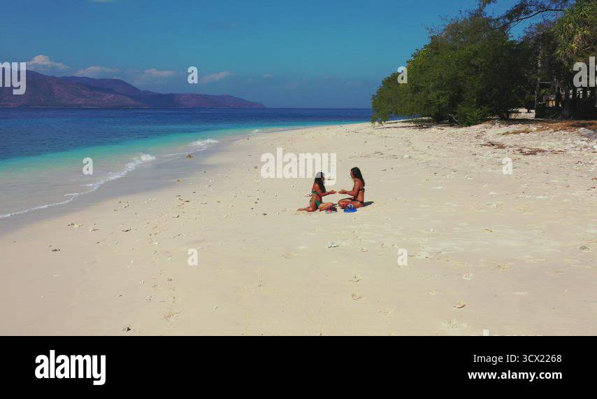 Modern beauty models on holiday enjoying life at the beach on summer ...