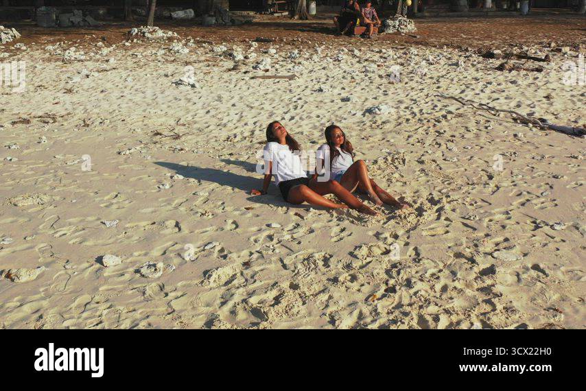 Modern beauty models on vacation enjoying life on beach on sunny blue ...