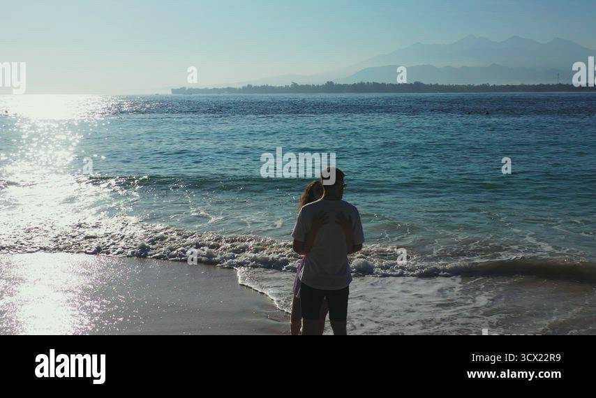 Beautiful couple on romantic honeymoon enjoy life on beach on clean ...