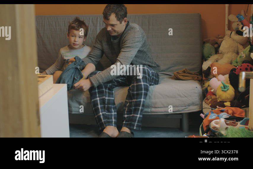 Dad getting child dressed Stock Videos & Footage - HD and 4K Video ...