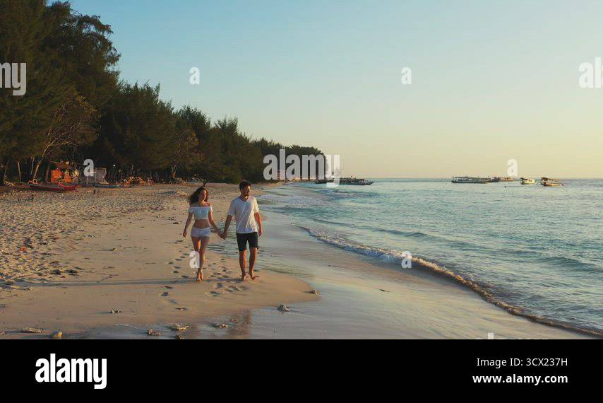 Romantic couple in love dating on vacation spend quality time on beach ...