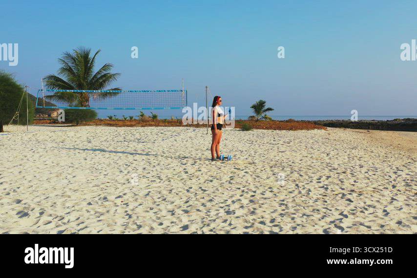 Modern smiling girls on holiday in the sun at the beach on paradise ...