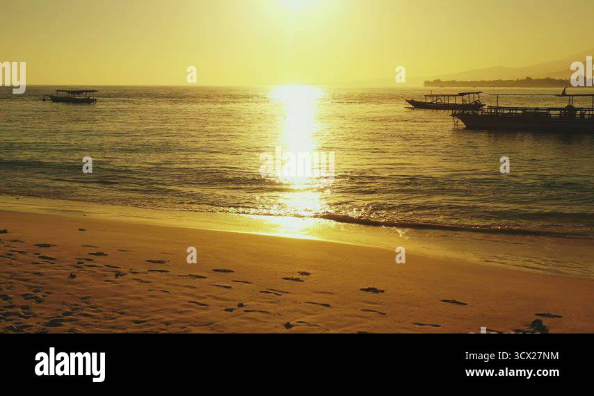 Wide above island view of a sandy white paradise beach and blue water ...
