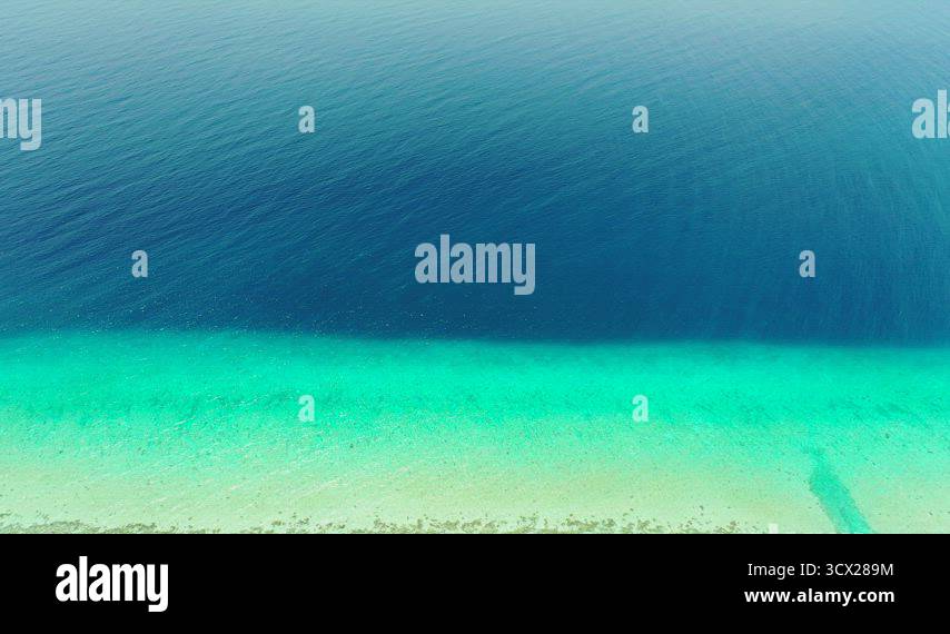 Natural overhead island view of a white sand paradise beach and aqua ...
