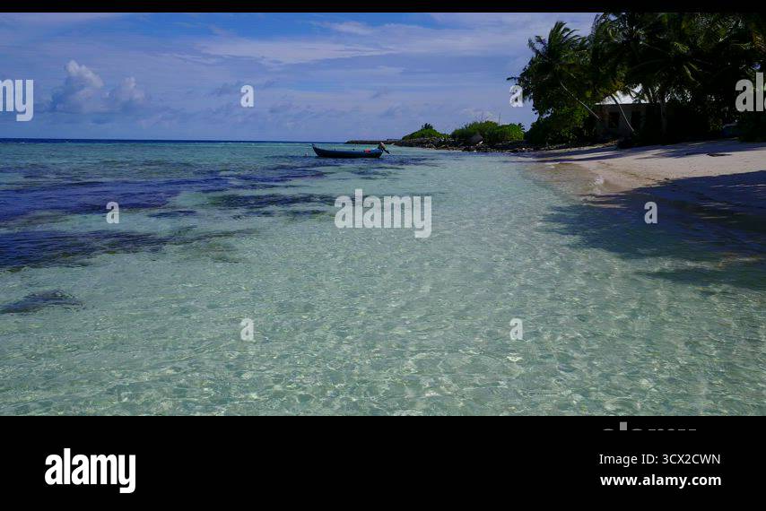 Wide above copy space shot of a sandy white paradise beach and blue ...
