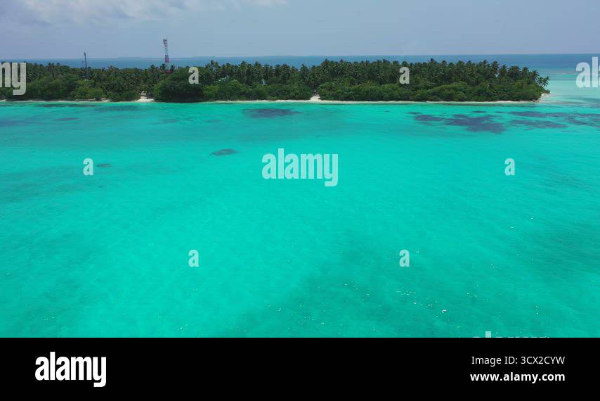 Natural overhead island view of a white sand paradise beach and blue ...