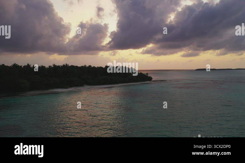 Natural flying travel shot of a white paradise beach and blue sea ...