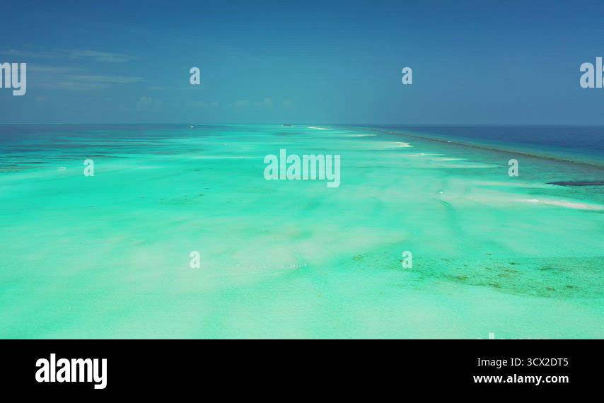 Wide above copy space shot of a white paradise beach and blue water ...