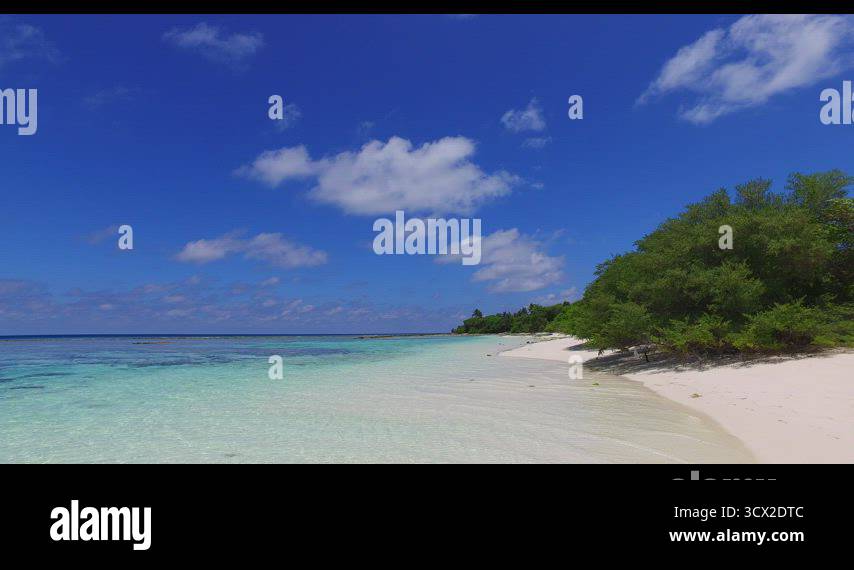 Wide overhead copy space shot of a sandy white paradise beach and blue ...