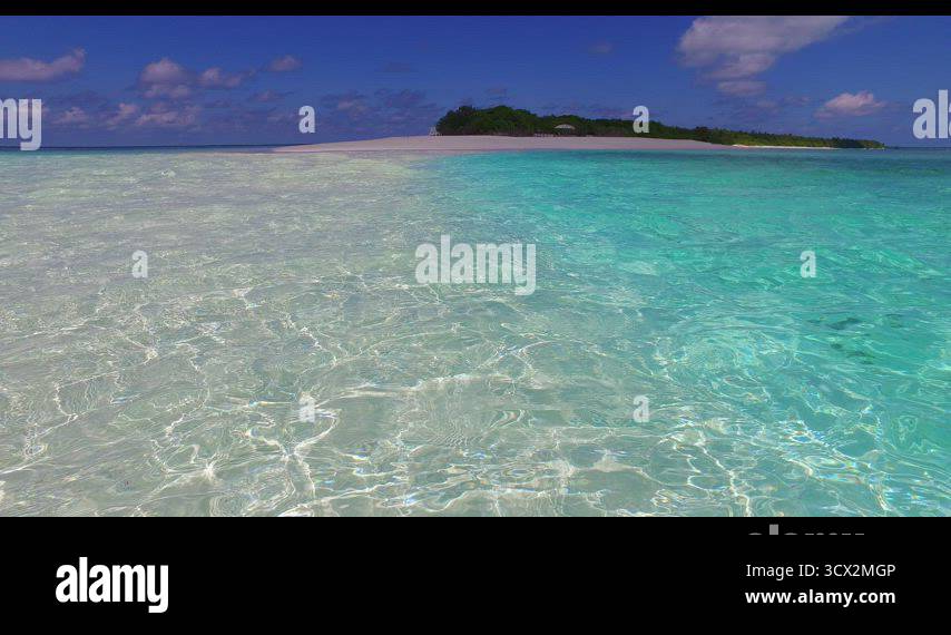 Daytime overhead clean view of a white sandy paradise beach and blue ...