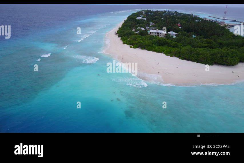 Daytime above island view of a white sand paradise beach and blue sea ...