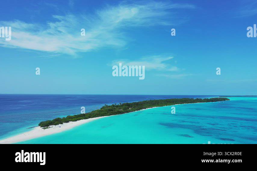 Wide aerial travel shot of a white paradise beach and blue water ...