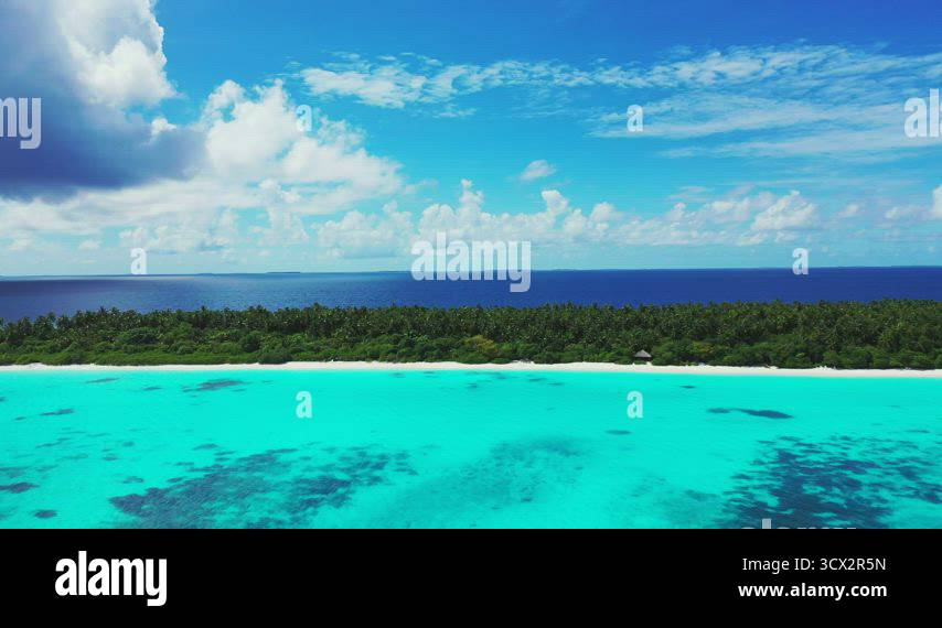 Tropical above island view of a sandy white paradise beach and aqua ...