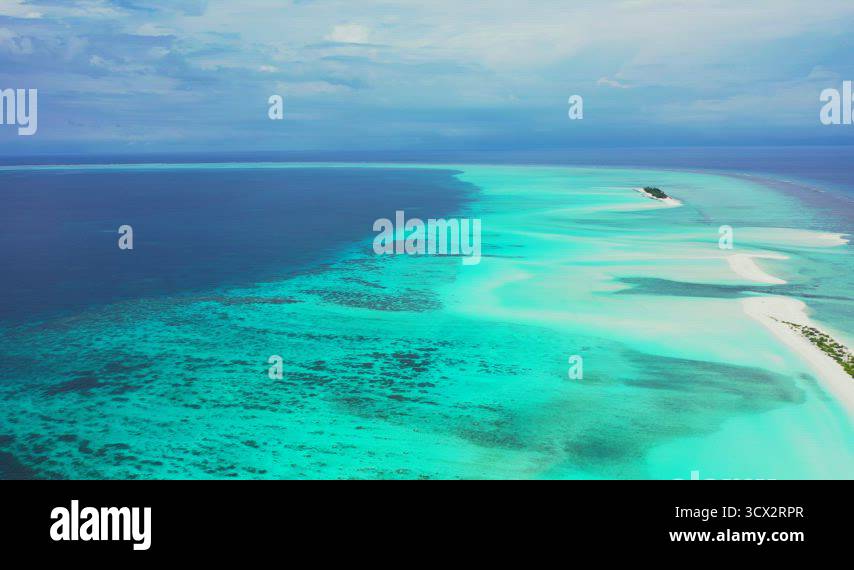 Daytime overhead island view of a white sand paradise beach and ...