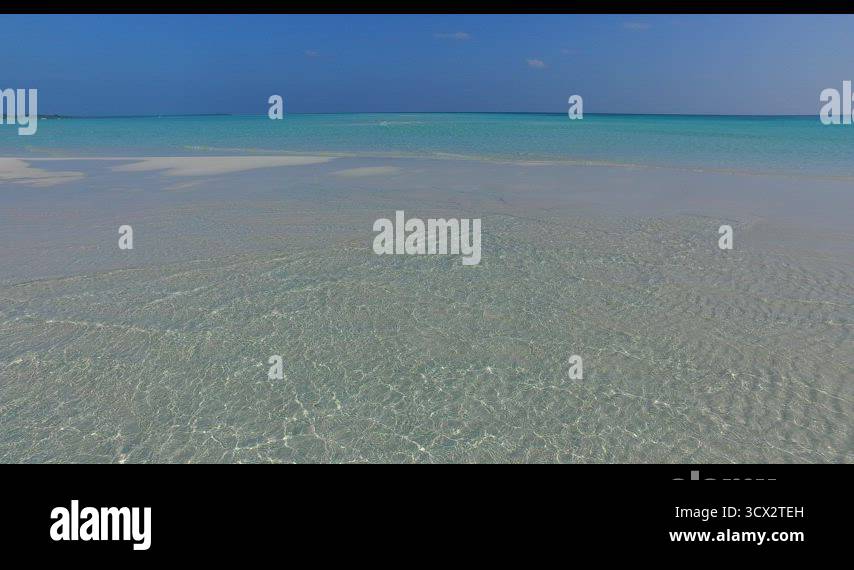 Natural overhead island view of a sandy white paradise beach and ...