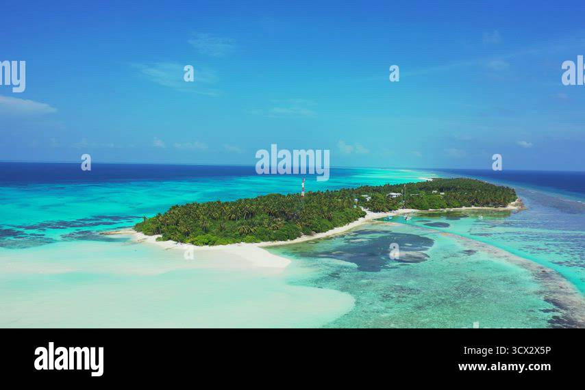 Beautiful aerial tourism shot of a paradise sunny white sand beach and ...