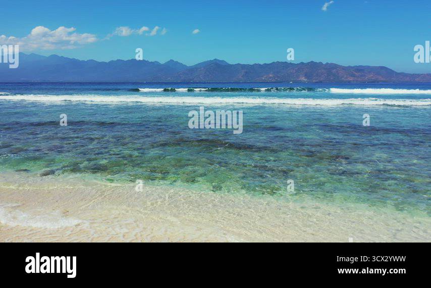 Beautiful drone abstract view of a sandy white paradise beach and blue ...