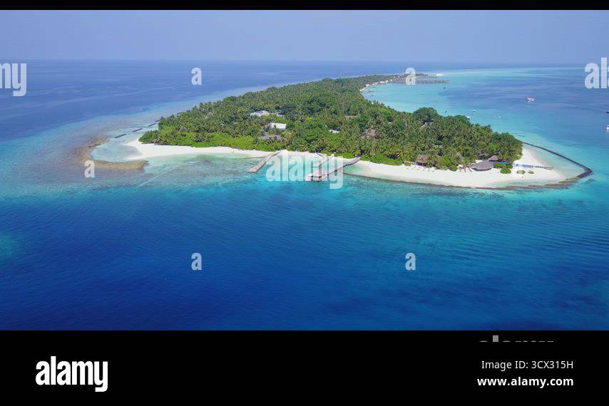 Tropical flying clean view of a sandy white paradise beach and blue ...