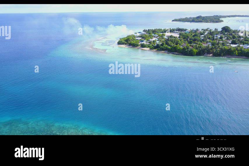 Wide angle overhead clean view of a white sandy paradise beach and blue ...