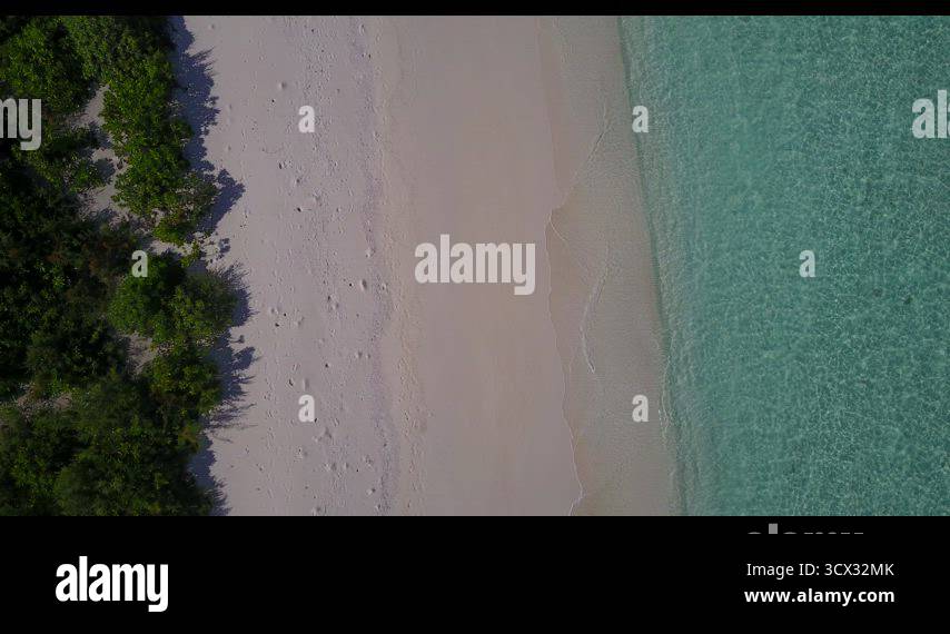 Wide above copy space shot of a white paradise beach and blue water ...