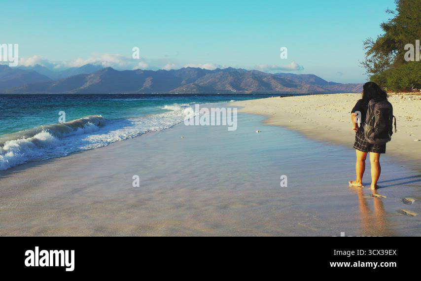 Young fun woman on holiday in the sun at the beach on summer white ...