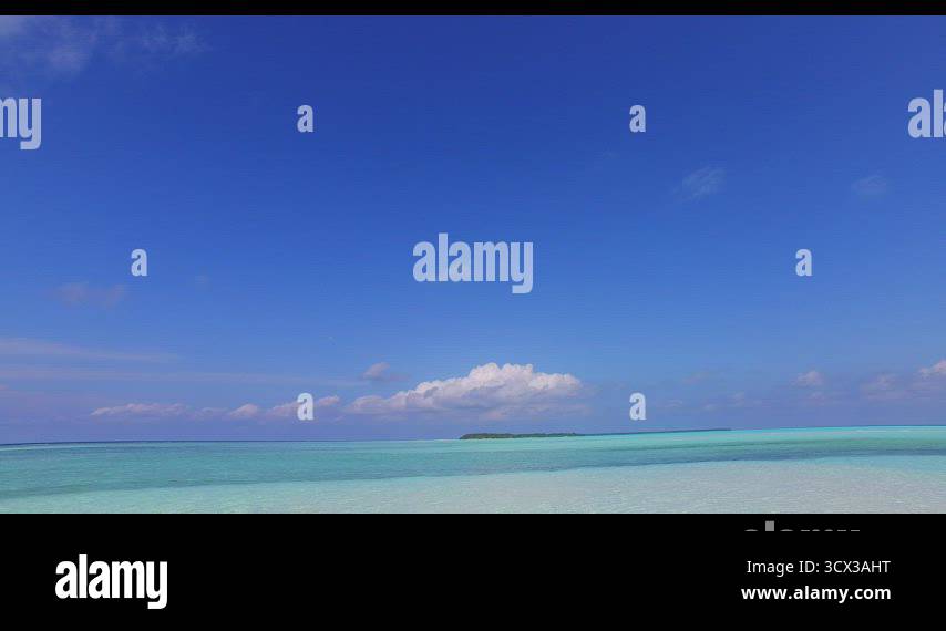 Daytime aerial tourism shot of a sunshine white sandy paradise beach ...