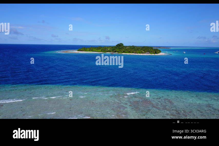 Wide drone clean view of a paradise sunny white sand beach and aqua ...