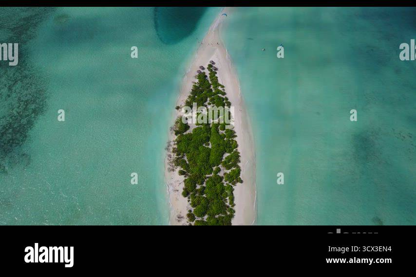 Wide angle overhead island view of a white paradise beach and blue ...