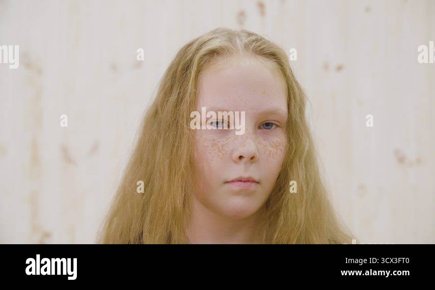 Portrait displeased girl looking with disgust to camera. Close up face ...