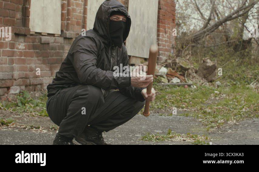 Masked bandit with baseball bat at abandoned place Stock Video Footage ...