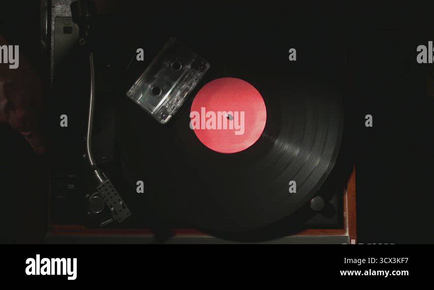 Vintage concept of audio tape cassette and vinyl music disc top view of ...