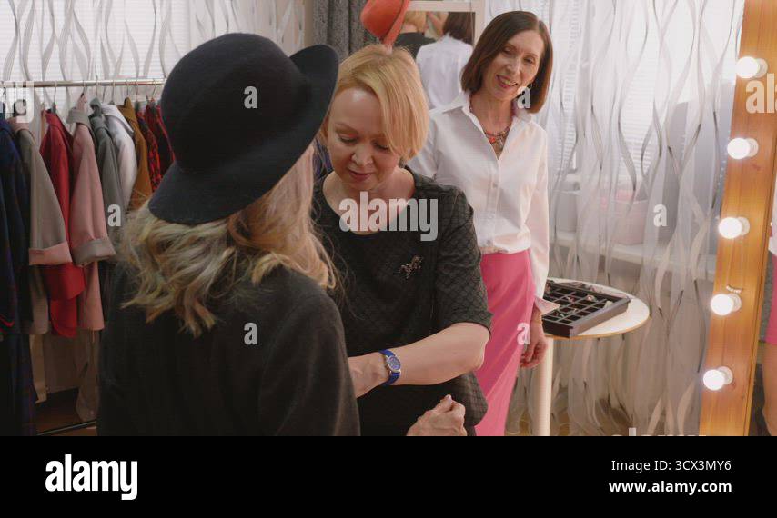 Woman Try Coat and Hat Looking at Mirror in Shop Stock Video Footage ...