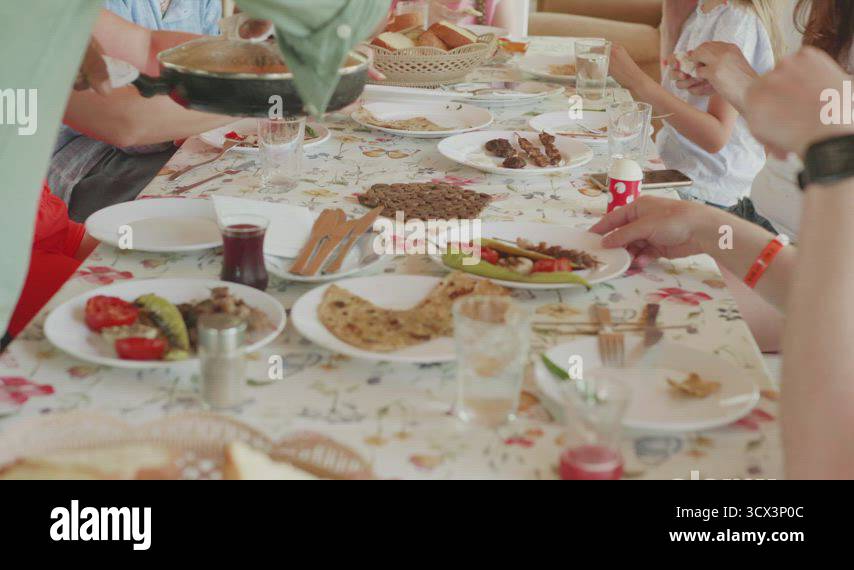 Dishes with homemade food dining table. Friendly family gathering ...
