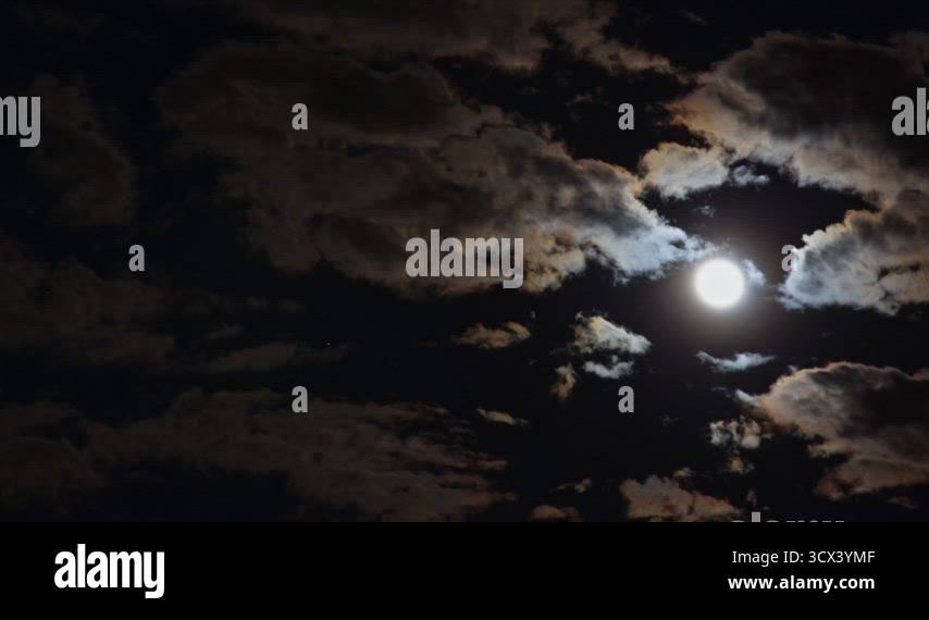Mysterious night sky with full dramatic moon clouds in the moon light ...