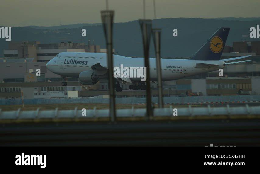Jumbojet Boeing 747 of Lufthansa approaching at the sunrise Stock Video ...