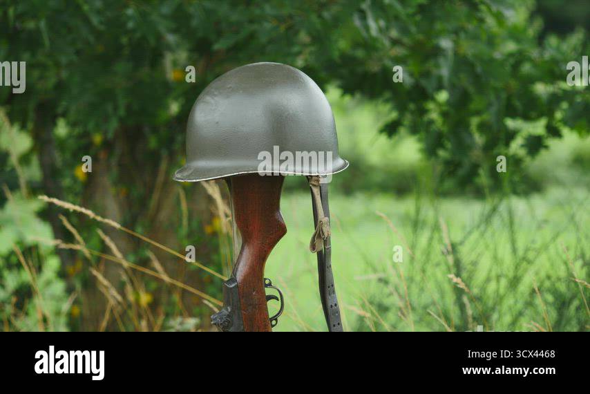 Memorial battlefield cross. Symbol of a fallen US soldier. M1 rifle ...