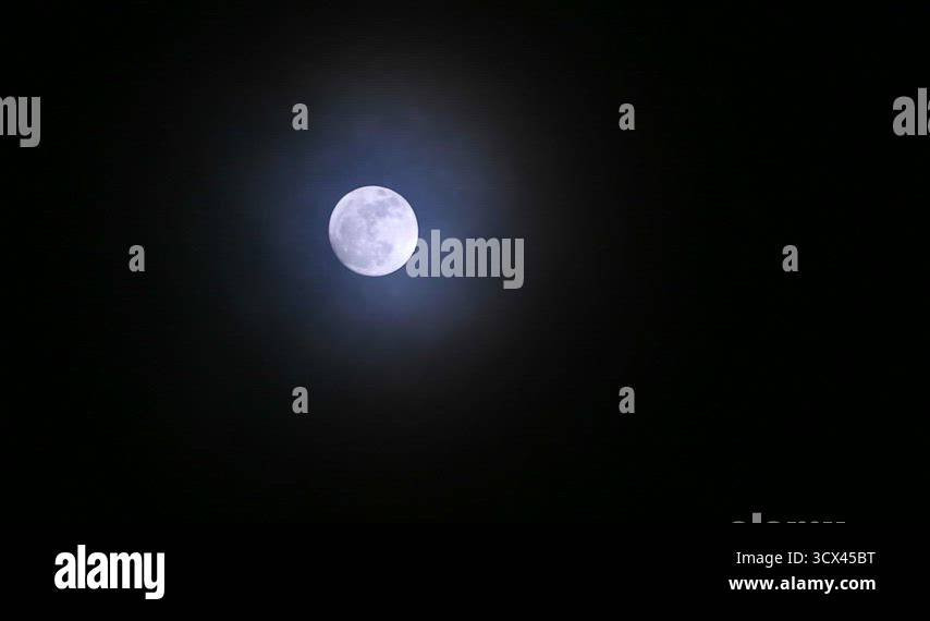 full buck moon rise on night sky and dark cloud moving pass Stock Video ...