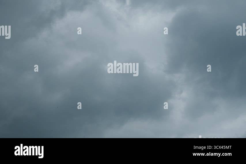 Footage of Sky and black cloud. Dark grey storm clouds. Dramatic sky ...