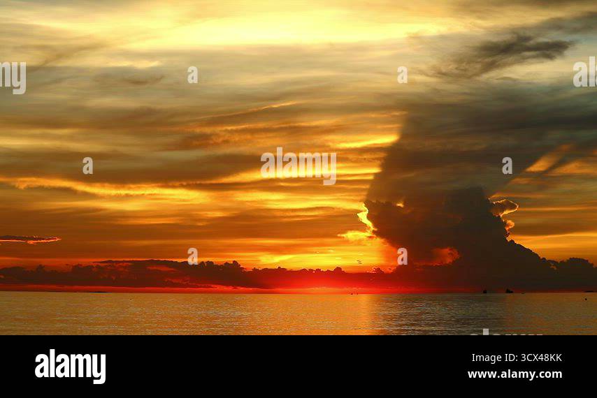 sunset on sea and sun ray back silhouette cloud Stock Video Footage - Alamy