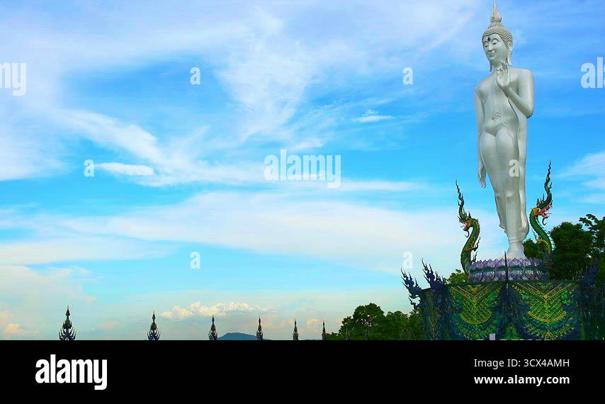 Pearl buddha stand on nagas with blue sky white cloud background Stock ...