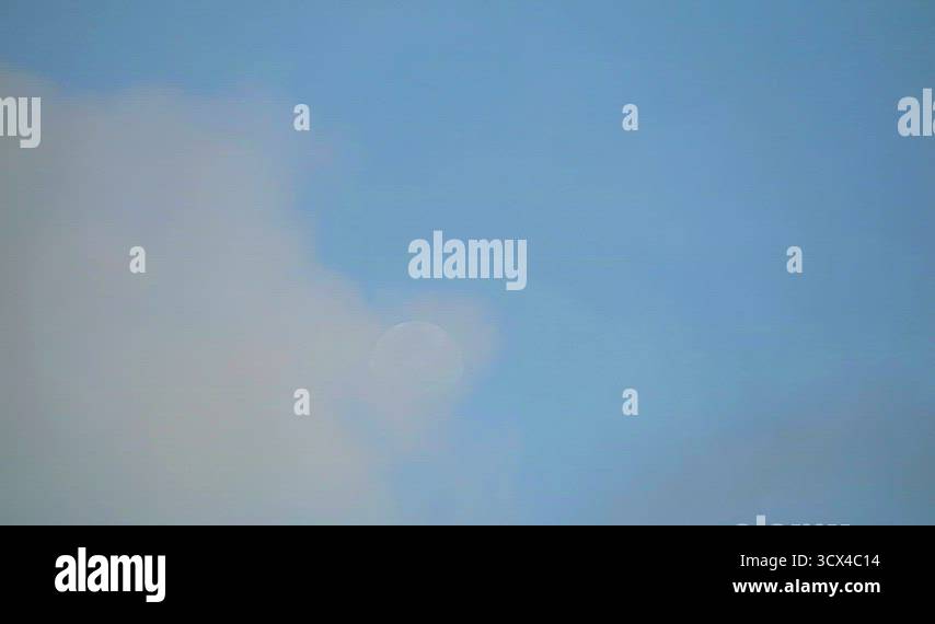 half moon on blue sky and dark cloud moving pass Stock Video Footage ...
