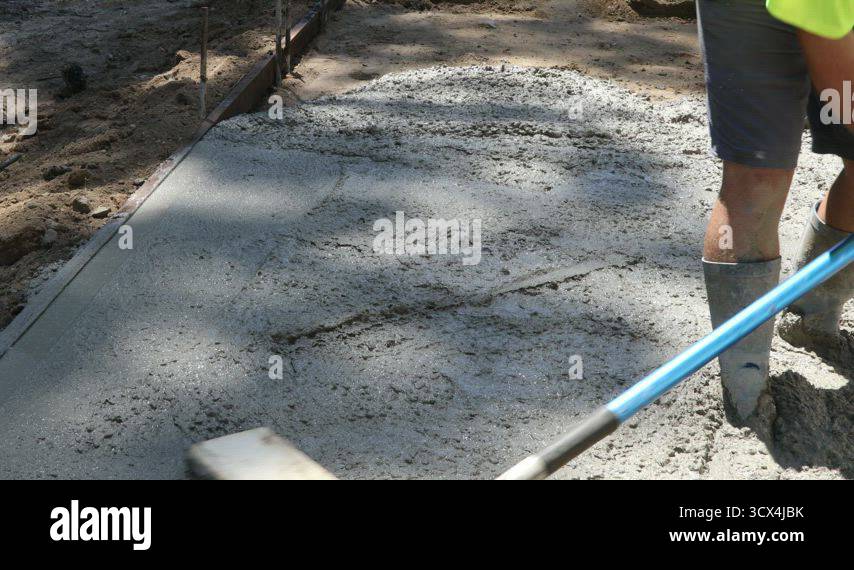 Construction filling formwork with cement and gravel worker pour cement ...