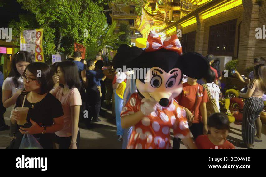 Disney mascot interact with the crowd at miaohui Stock Video Footage ...