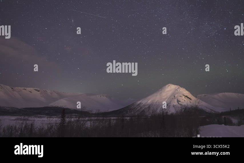 Time Lapse of Night Starry Sky and Green Northern Lights in Snowy ...